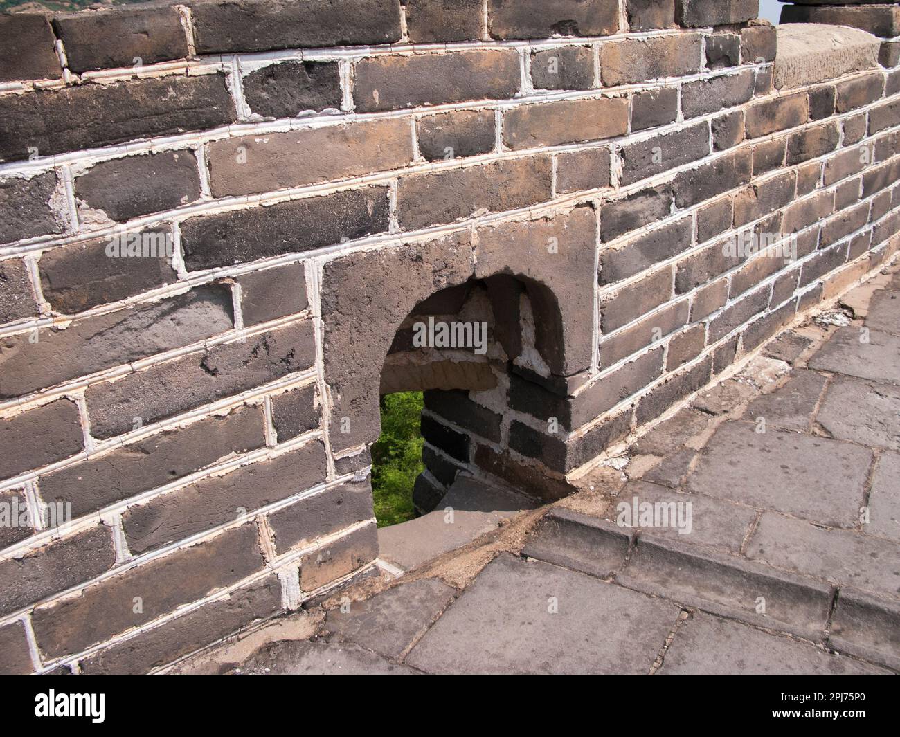 Water drain port in the brick parapet of restored renewed stretch of ...