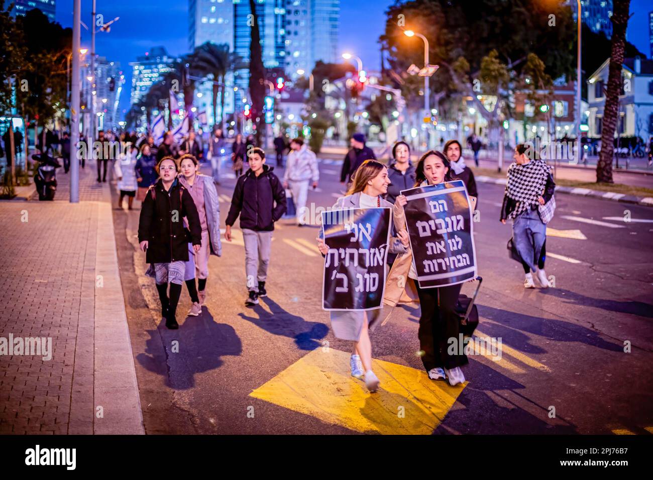 Tel Aviv, Israel. 30th Mar, 2023. Reform supporters march with placards ...
