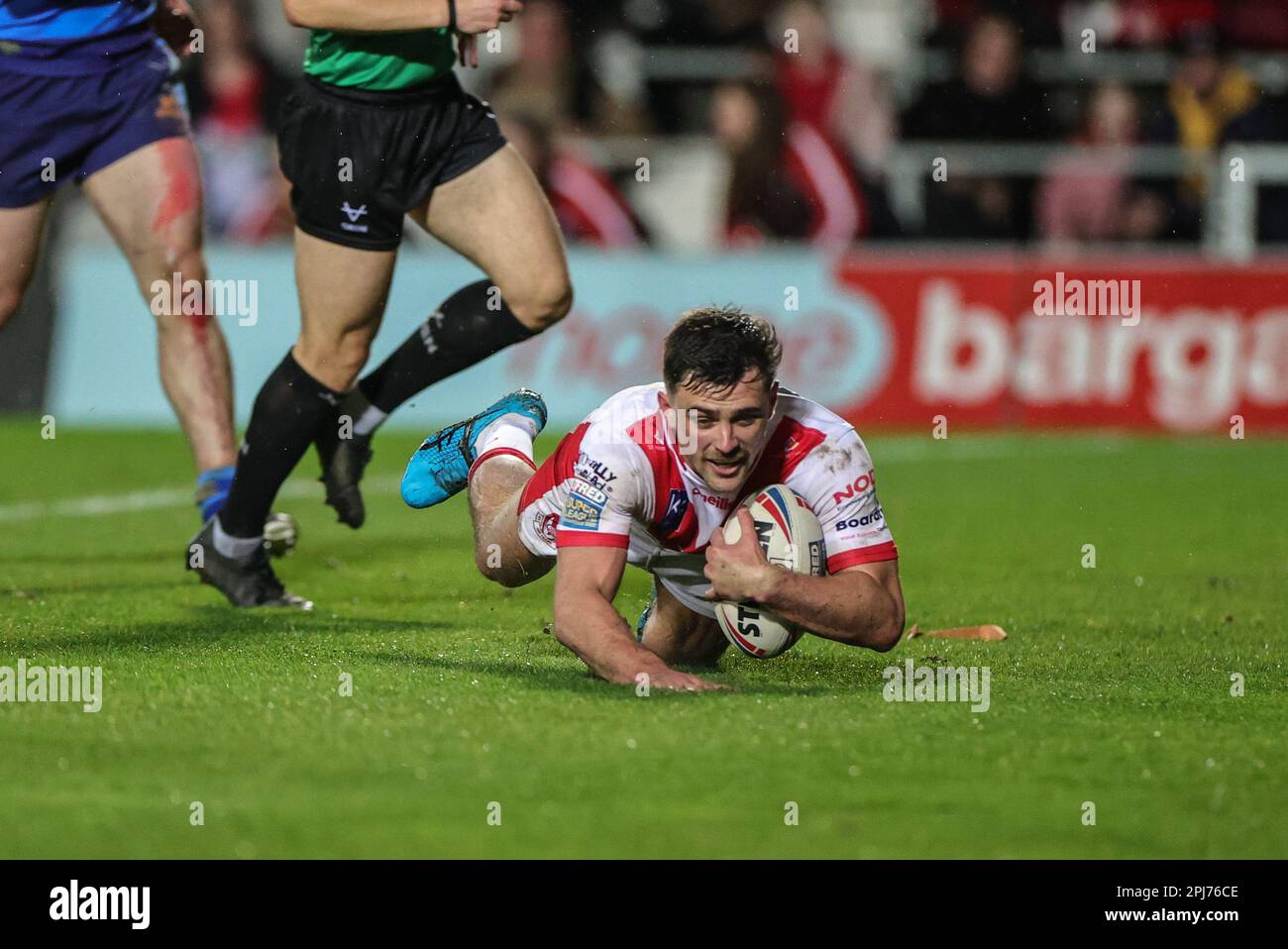 St Helens, UK. 31st Mar, 2023. Lewis Dodd #7 of St Helens goes over for ...