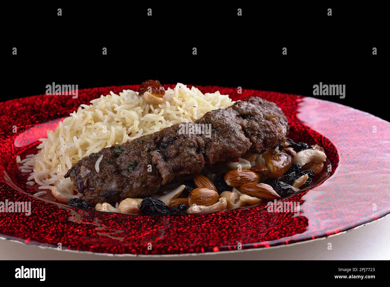 Colorful Pilaf with Tender Kabobs, Caramelized Nuts, and Raisins Stock ...