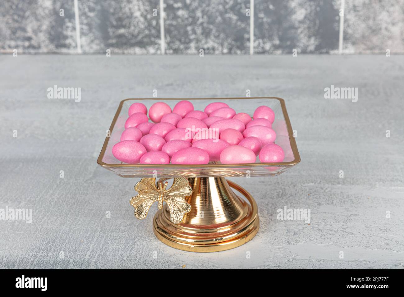 Colorful almond candies in the stylish, crystal candy bowl, almond ...