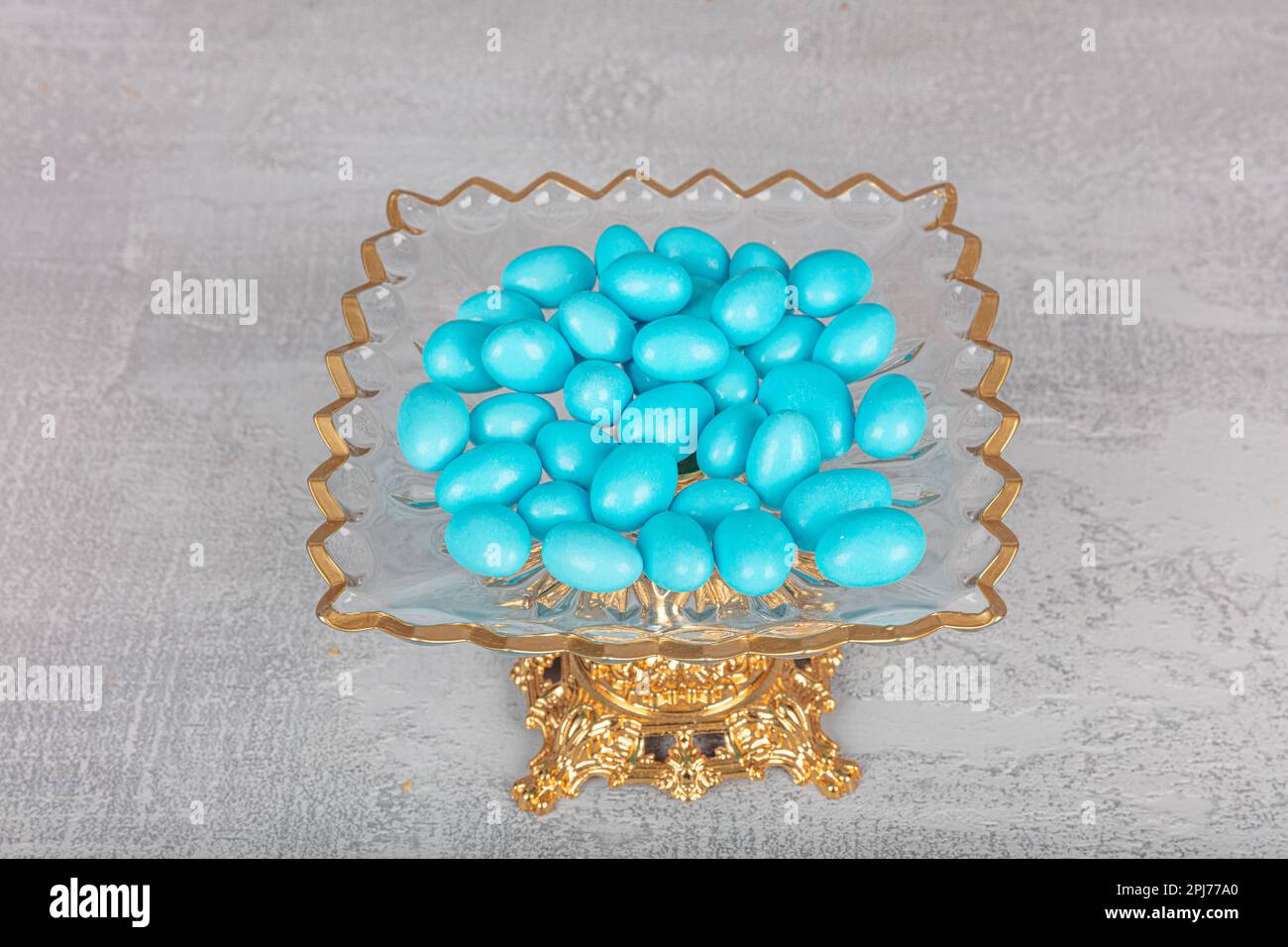 Colorful almond candies in the stylish, crystal candy bowl, almond ...