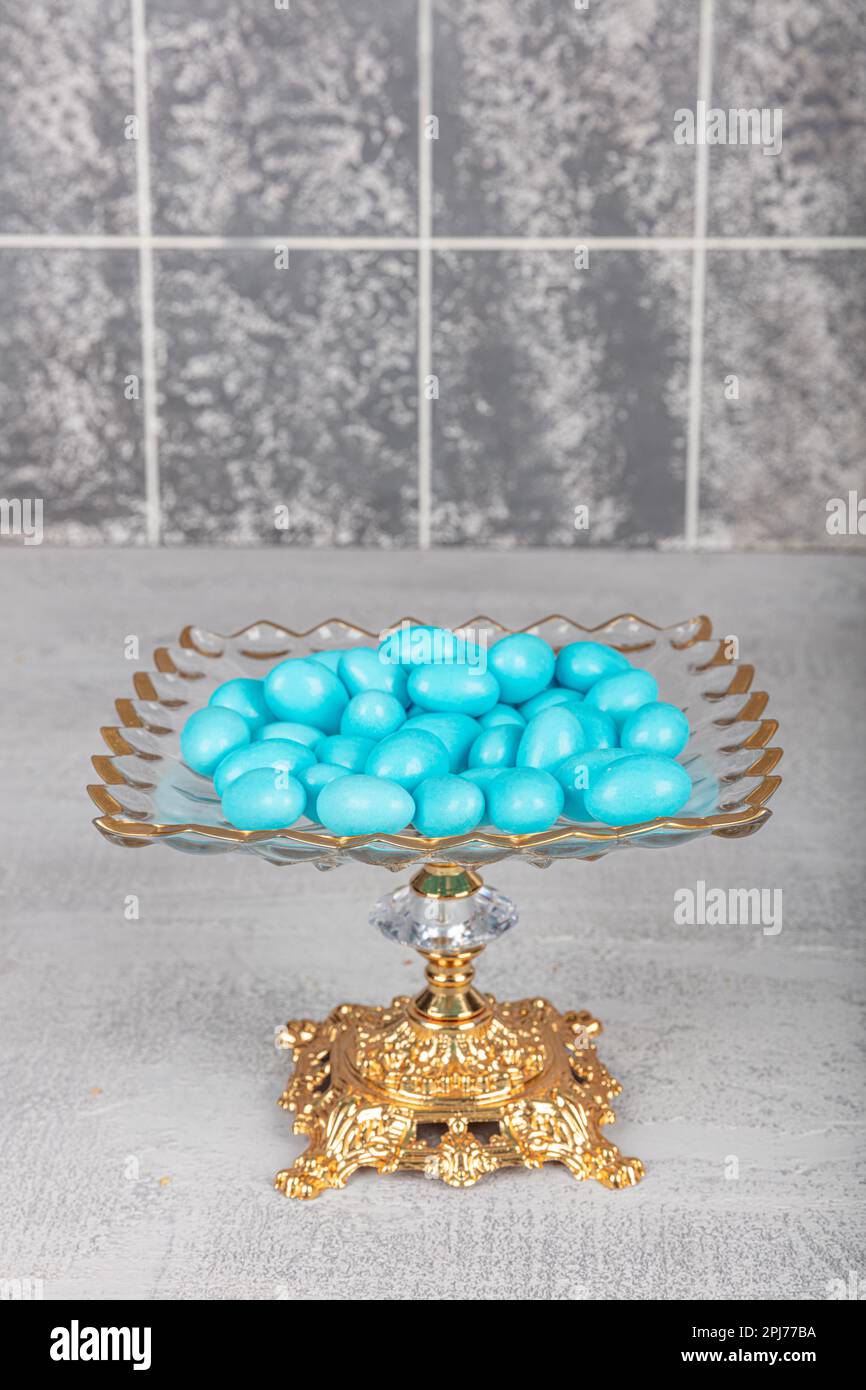 Colorful almond candies in the stylish, crystal candy bowl, almond ...