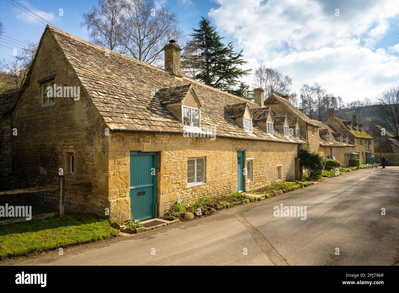 Medieval stone built traditional cottages with green door at Snowshill ...