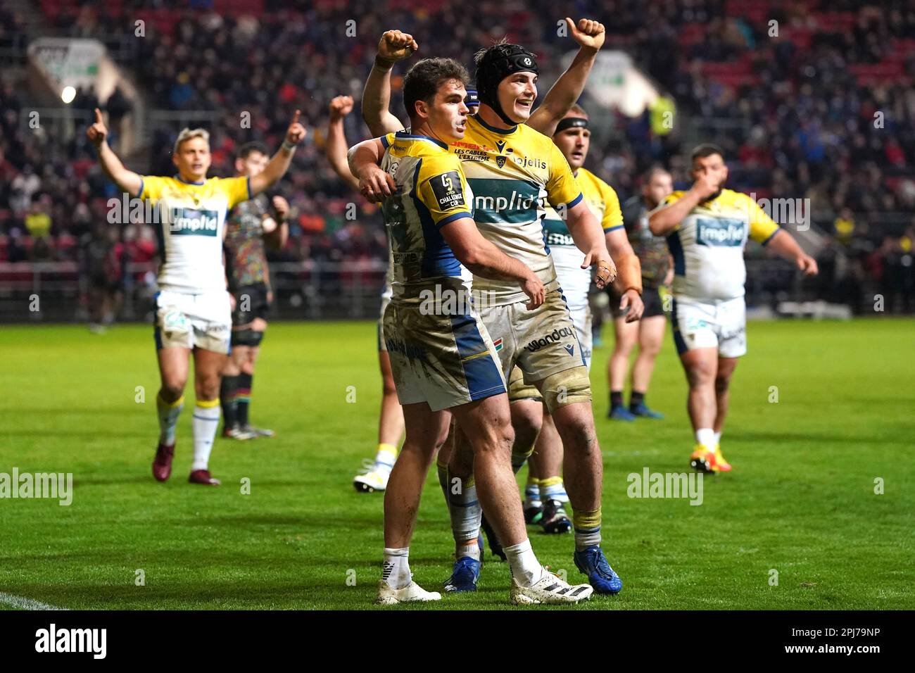 Clermont Auvergne's Damian Penaud (centre) and Thibaud Lanen celebrate ...
