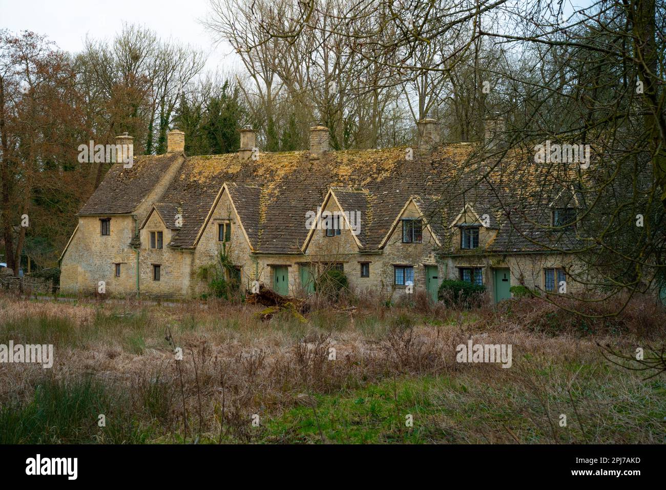 Iconic row of medieval stone built cottages in the picturesque village ...