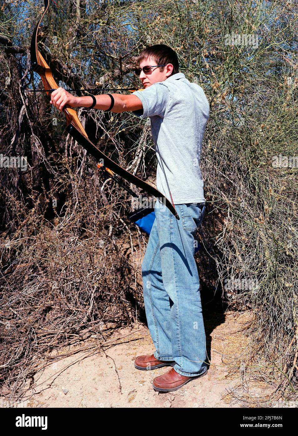 Young archer shooting a traditional recurve bow Stock Photo - Alamy