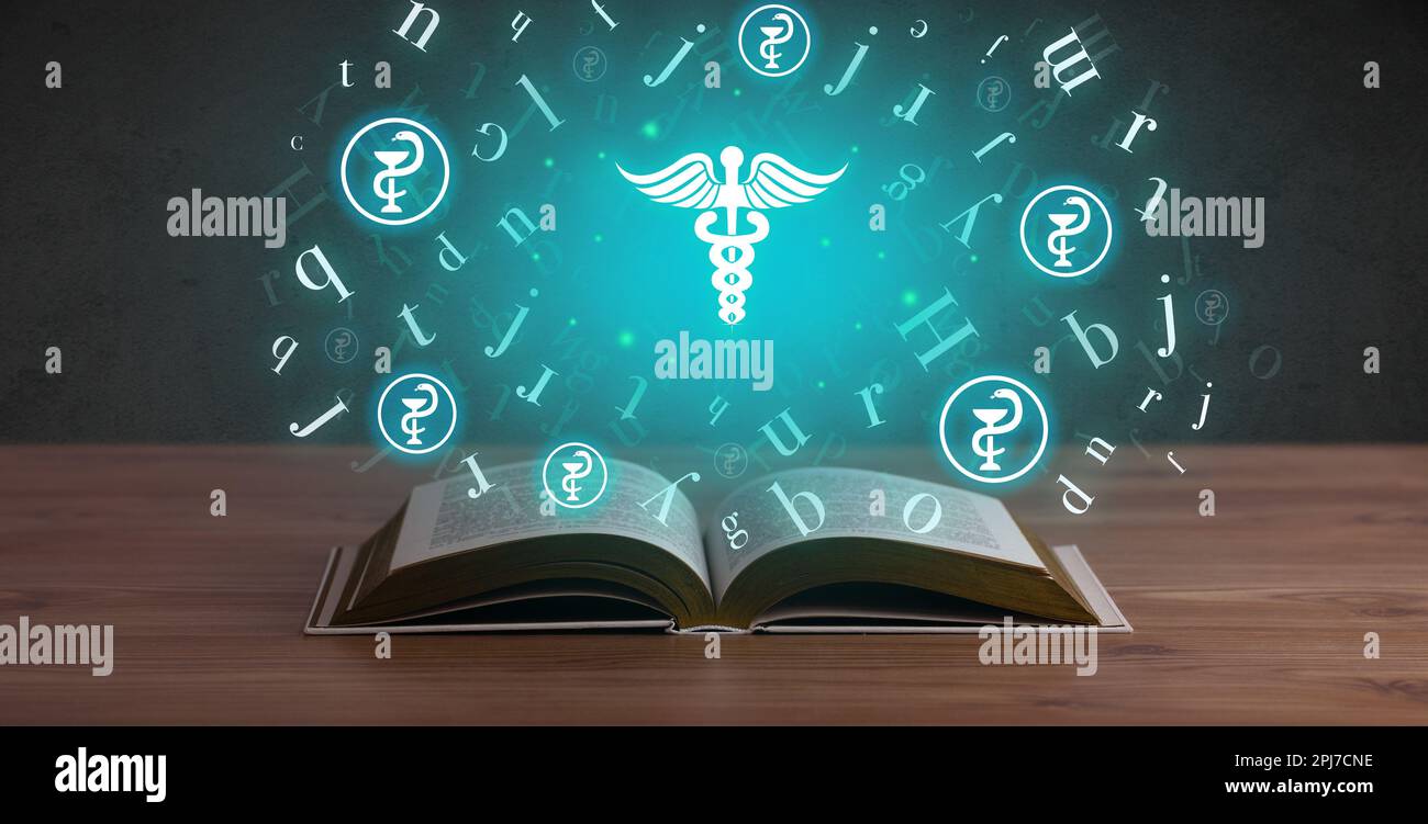 Open medical book with health icons above Stock Photo - Alamy
