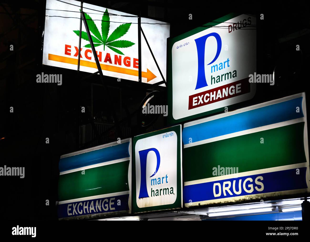 A detail view of a weed / marijuana neon sign above a money exchange ...