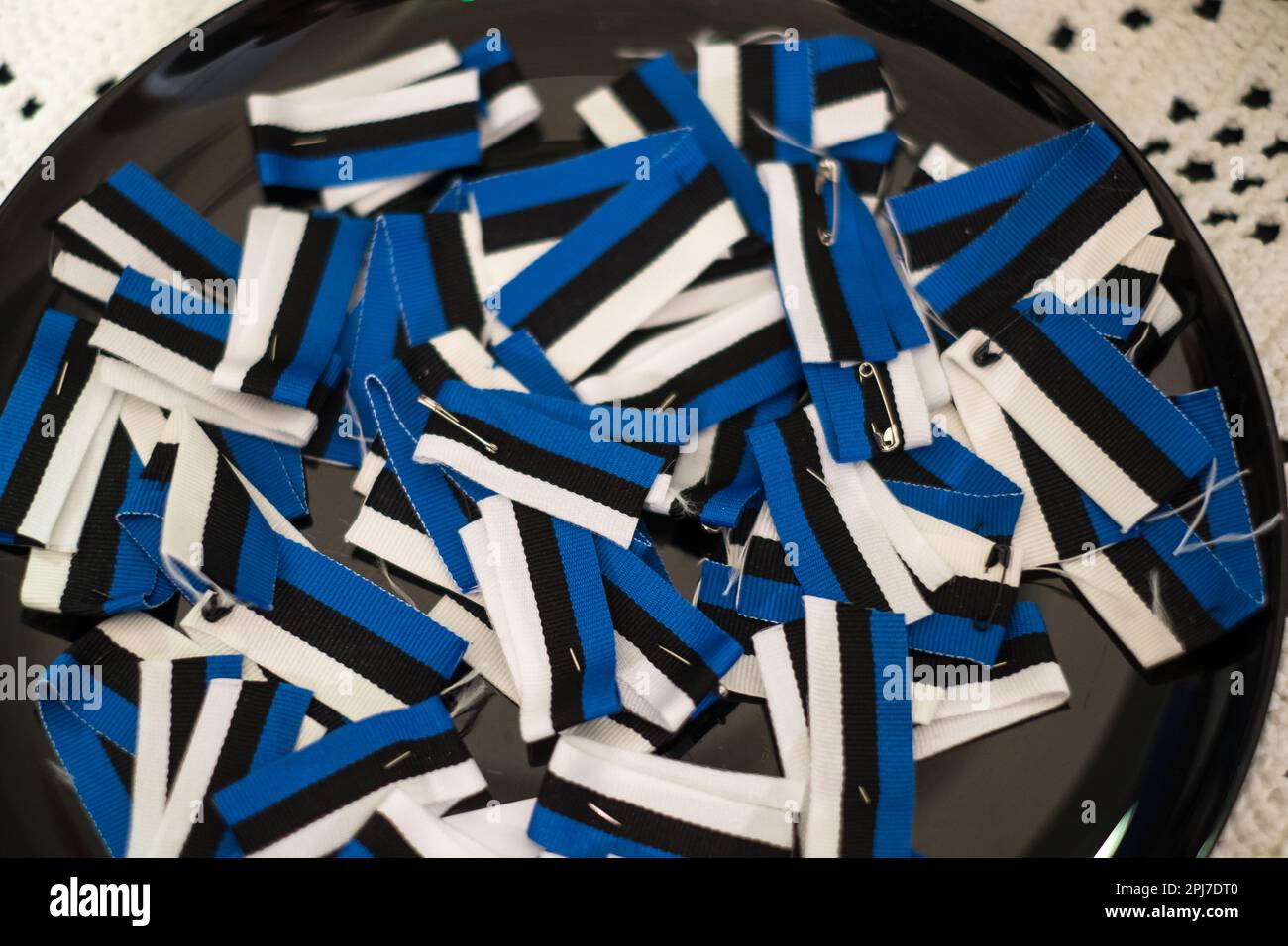 Estonian flag ribbons with safety pins Stock Photo - Alamy