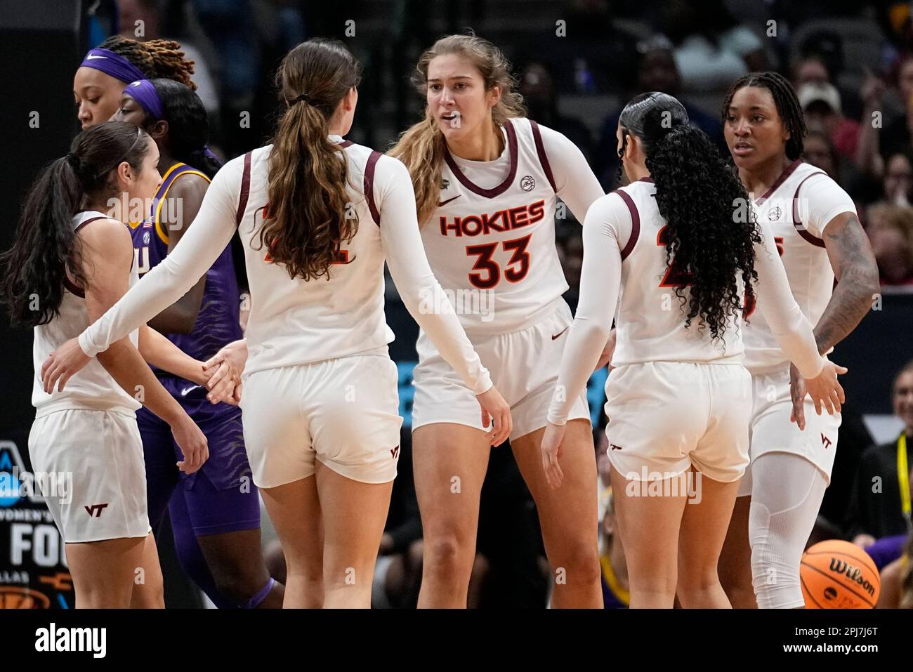 Virginia Tech's Elizabeth Kitley celebrates with teammates after making ...