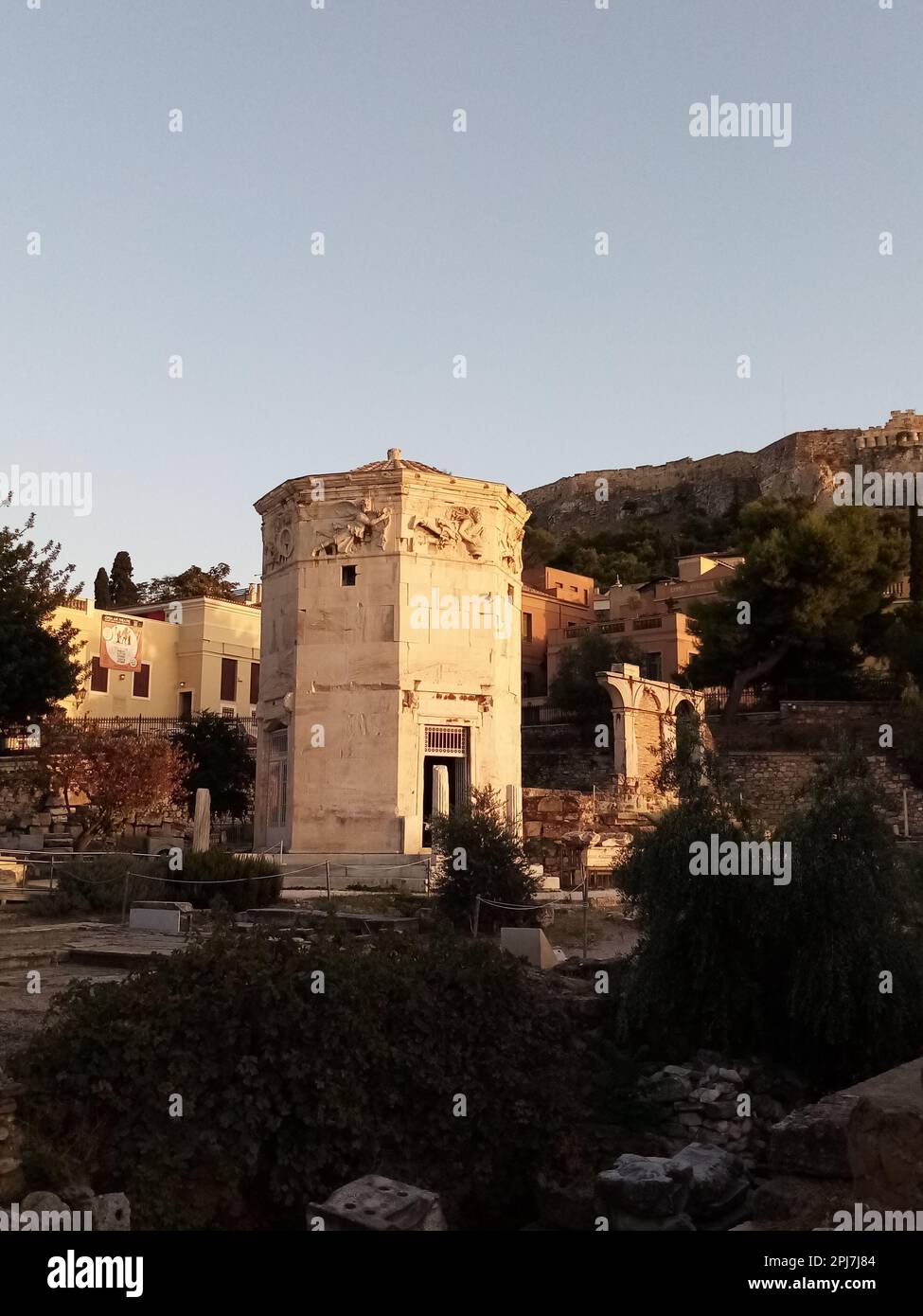 A majestic mountain backdrop frames the ruins of an ancient structure ...