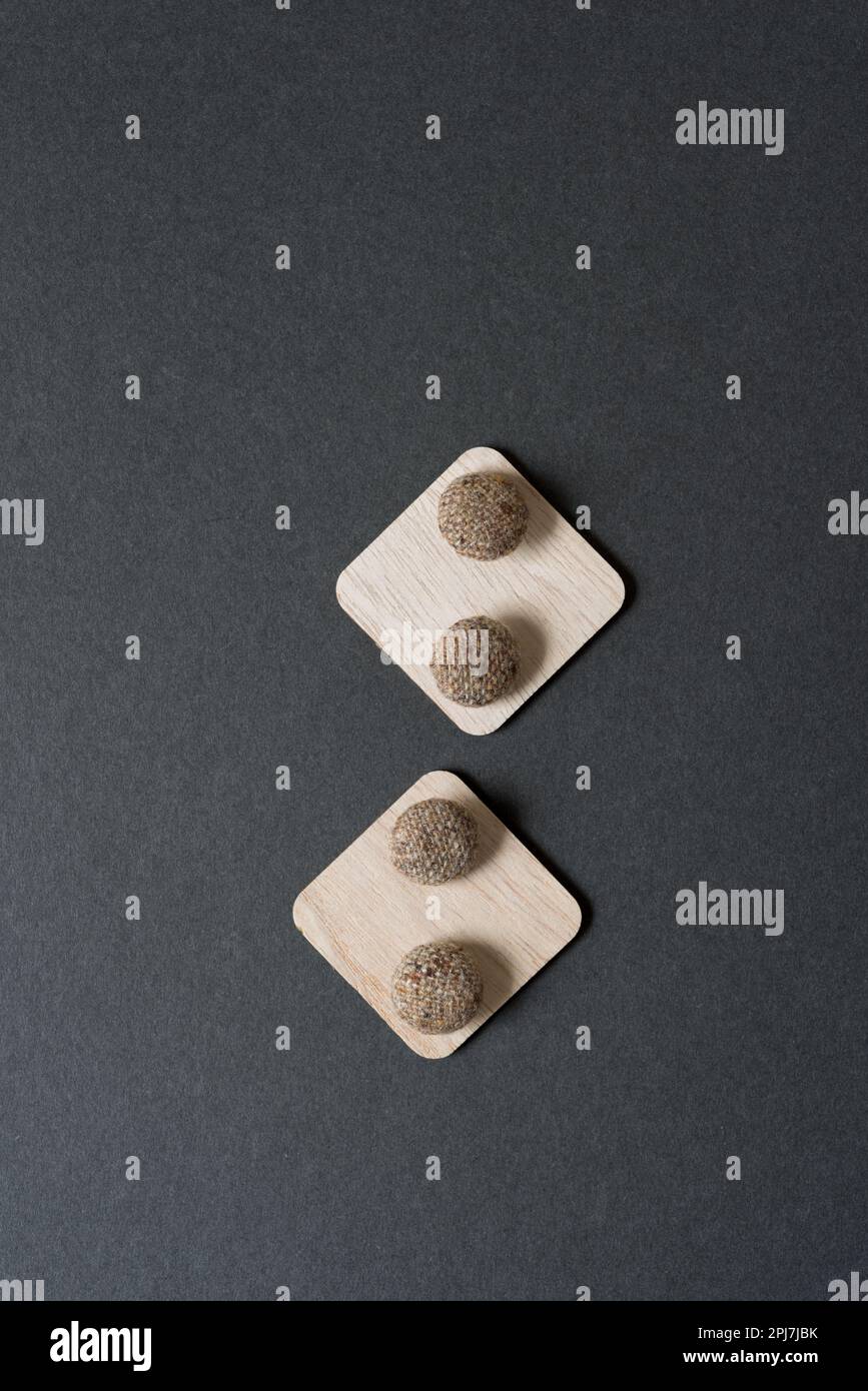 decorative brown cloth buttons and wood square shapes Stock Photo - Alamy