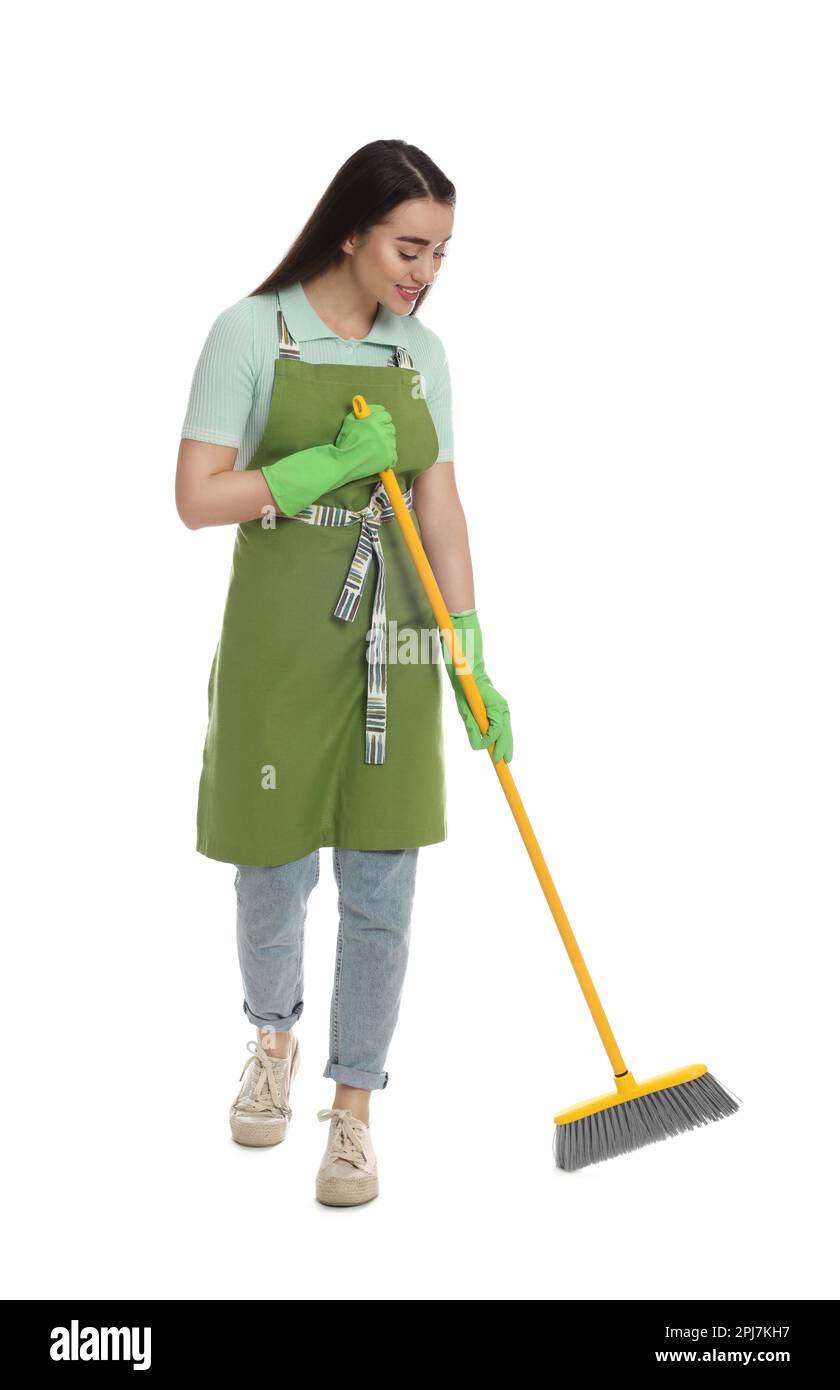 Beautiful young woman with broom on white background Stock Photo - Alamy
