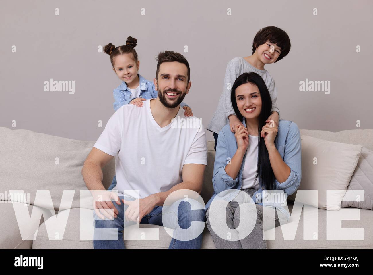 Word Welcome and portrait of happy family on sofa Stock Photo - Alamy