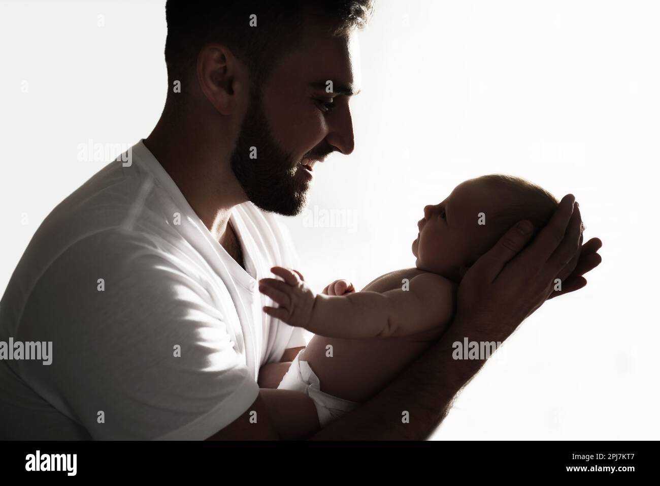 Father with his newborn baby on white background Stock Photo - Alamy