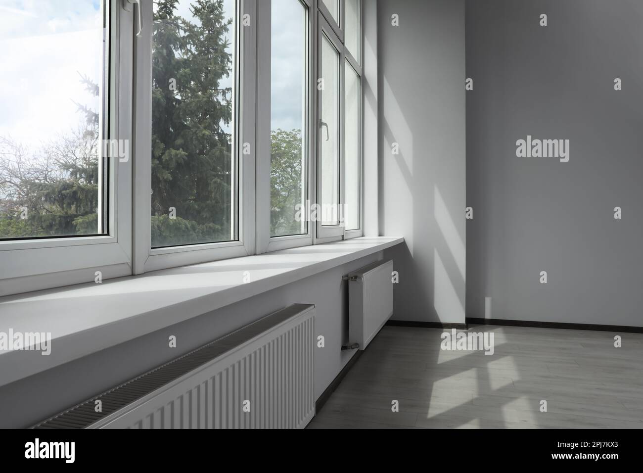 Modern office with window and radiators. Interior design Stock Photo ...