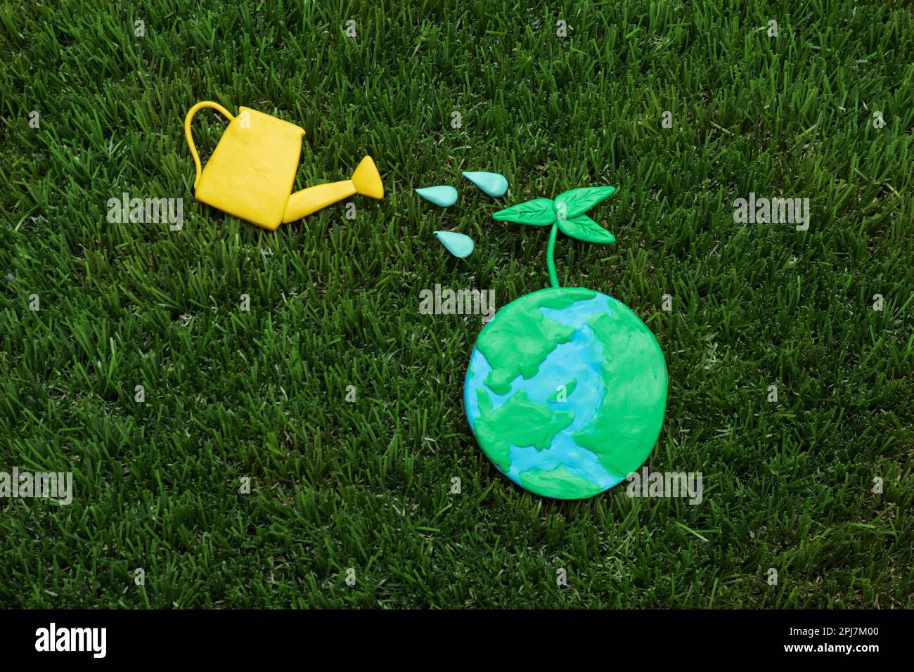 Happy Earth Day. Flat lay composition with plasticine planet and ...