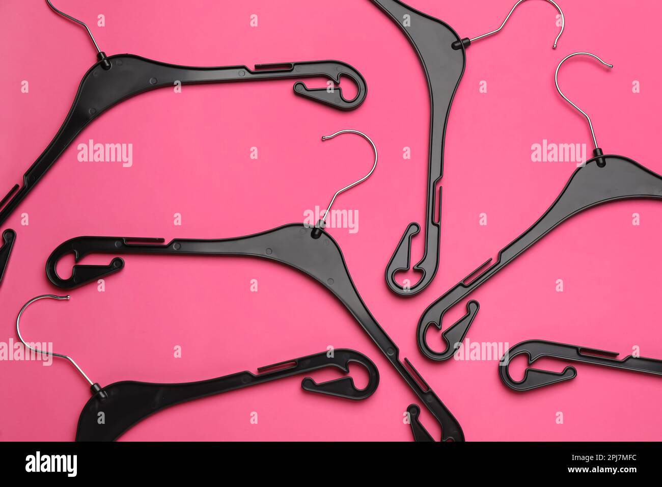 Black clothes hanger with clips hi-res stock photography and images - Alamy
