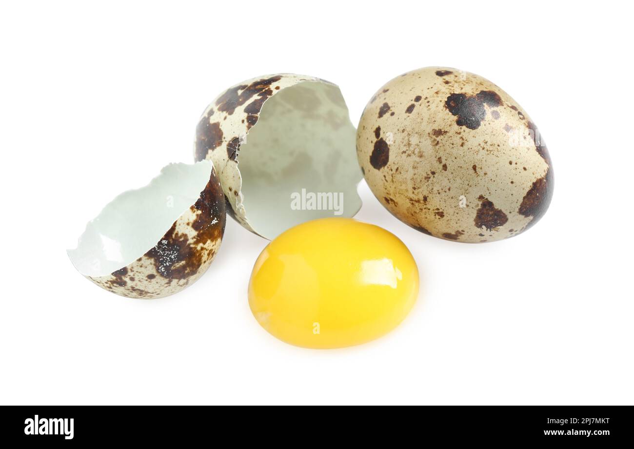 Whole and cracked quail eggs on white background Stock Photo - Alamy