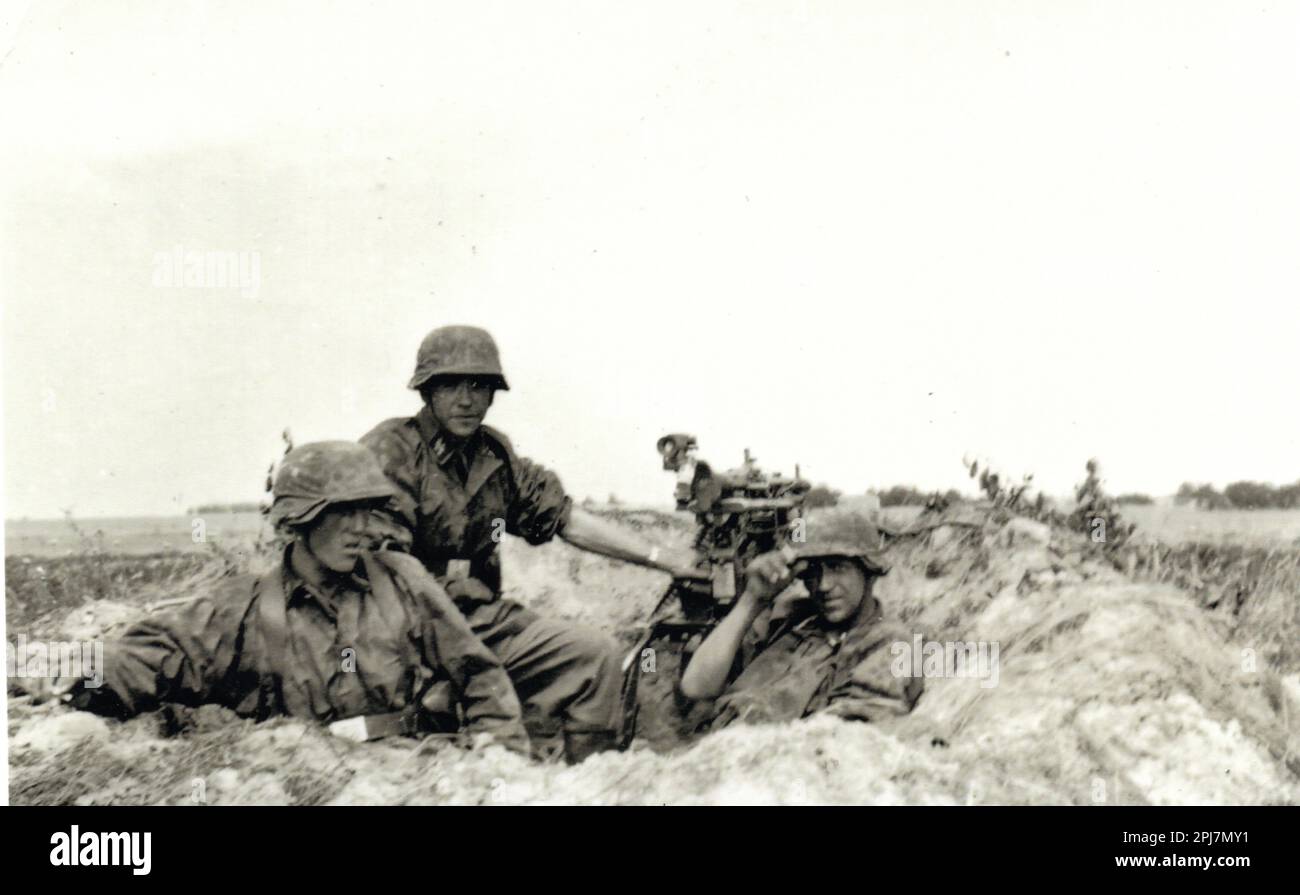Worl War Two B&W photo German Soldiers in Camo Smocks relax in an MG ...