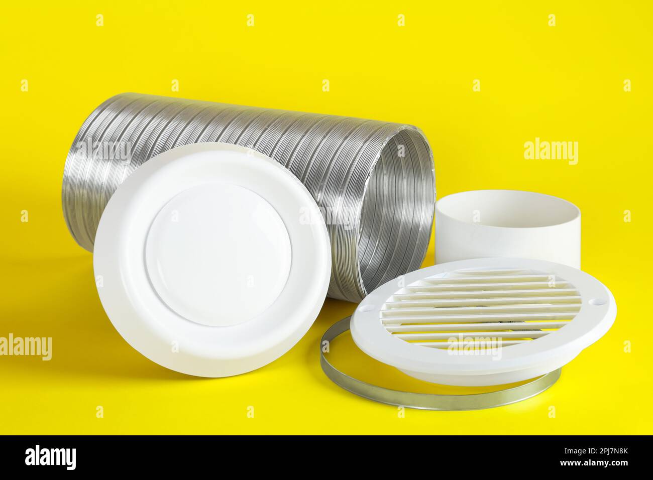 Parts of home ventilation system on yellow background Stock Photo - Alamy