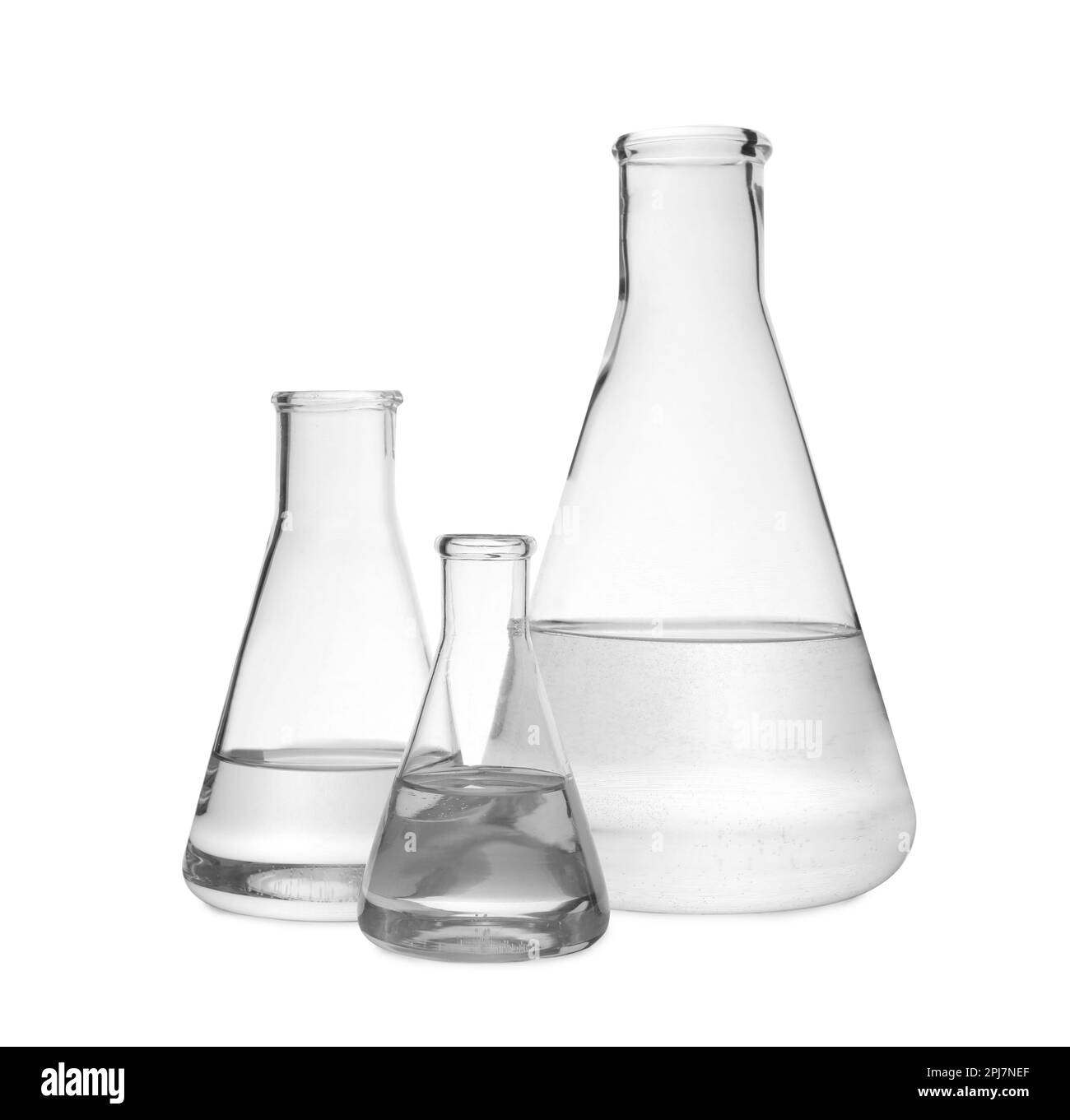 Flasks with transparent liquid on white background Stock Photo - Alamy