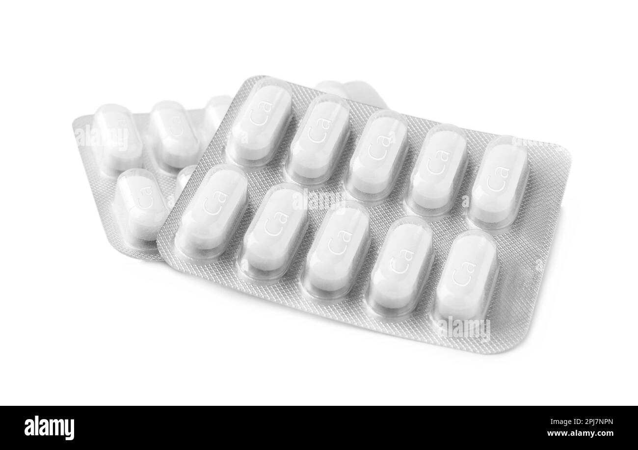 Calcium supplement pills in blister packs on white background Stock ...