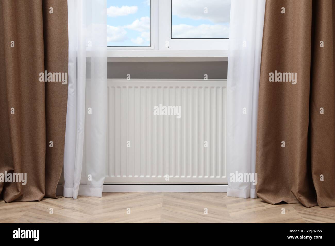 Modern radiator at home. Central heating system Stock Photo - Alamy