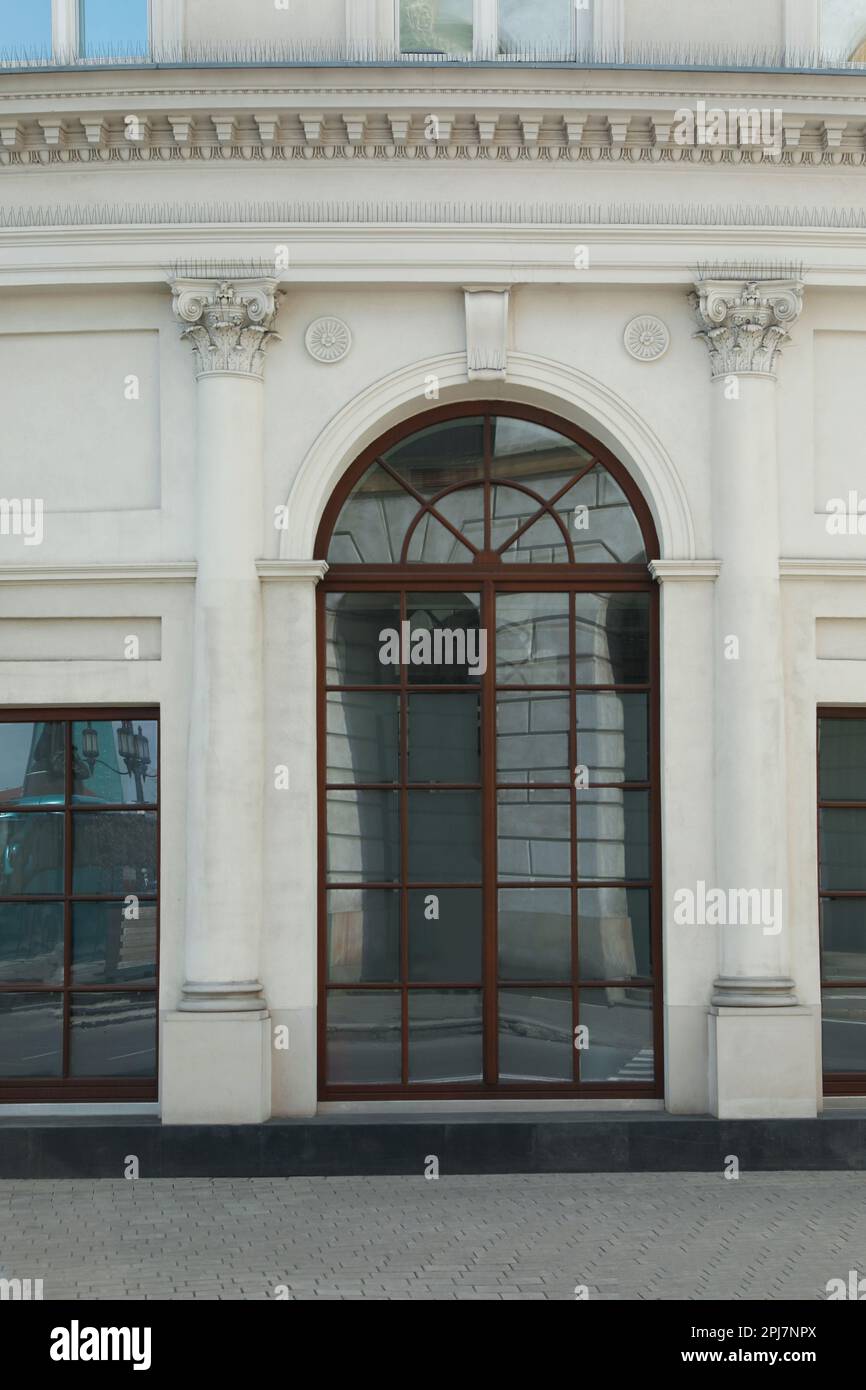 View of building with arched and ordinary windows Stock Photo - Alamy