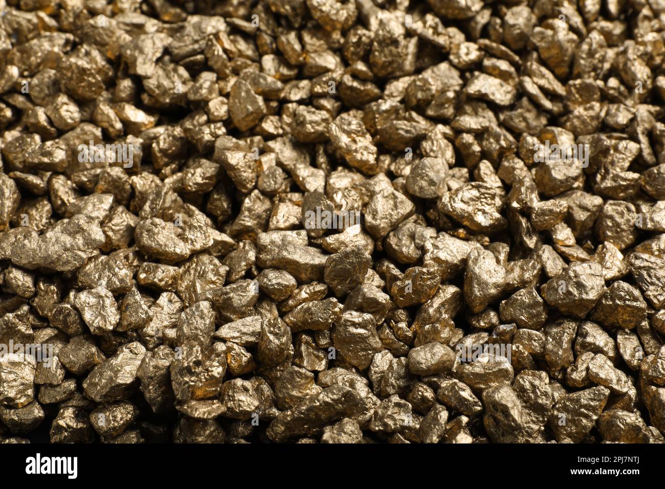 Pile of gold nuggets as background, closeup Stock Photo - Alamy