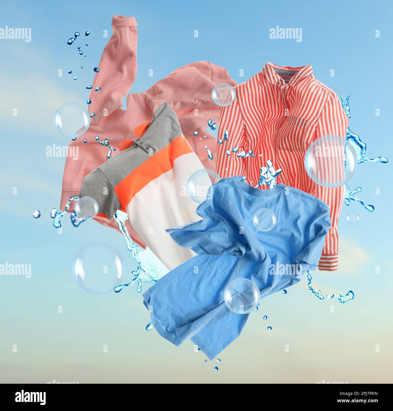 Washing powder bubbles and clothes in blue sky Stock Photo - Alamy