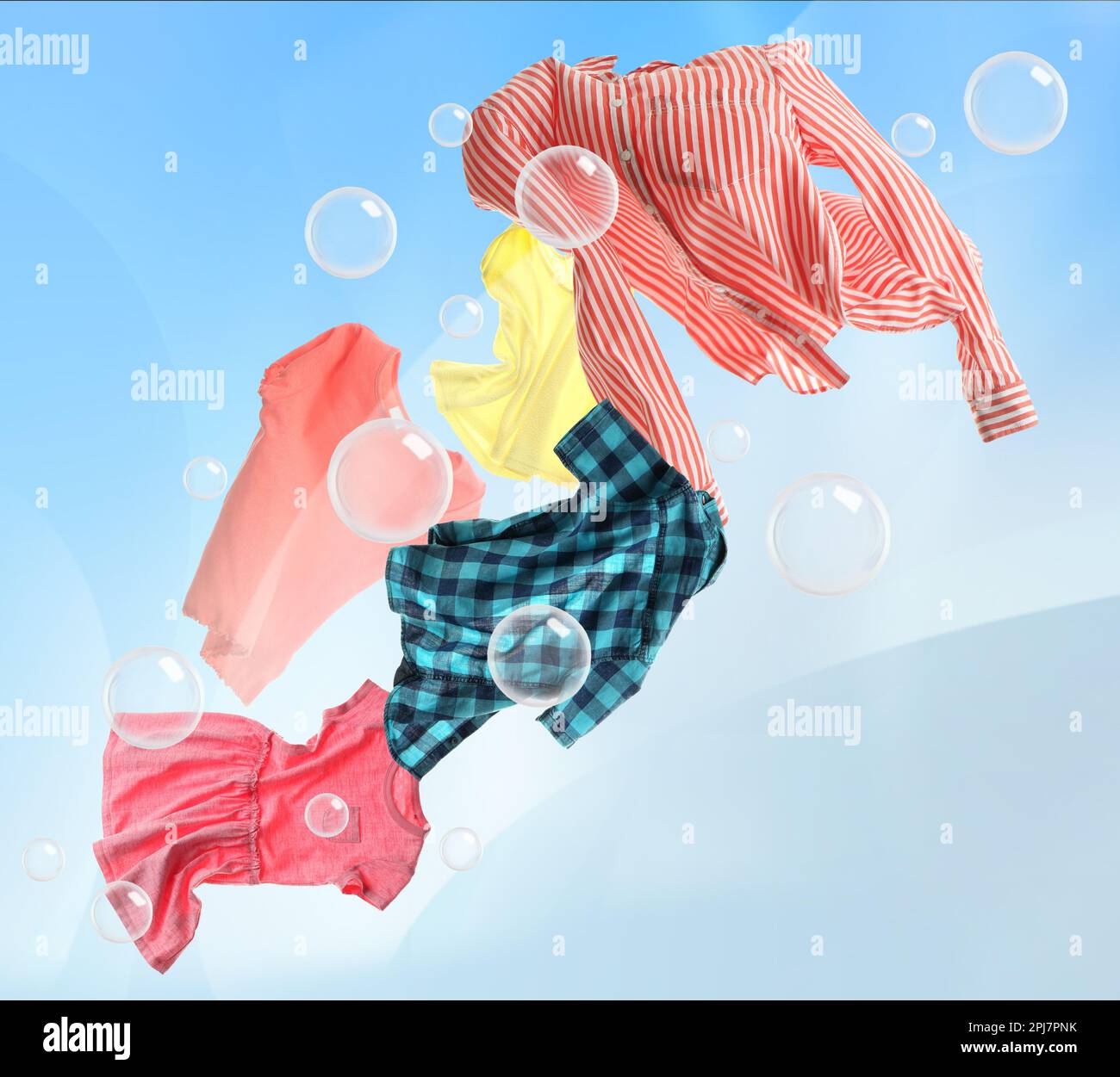 Washing powder bubbles and clothes flying in cloudy sky Stock Photo - Alamy