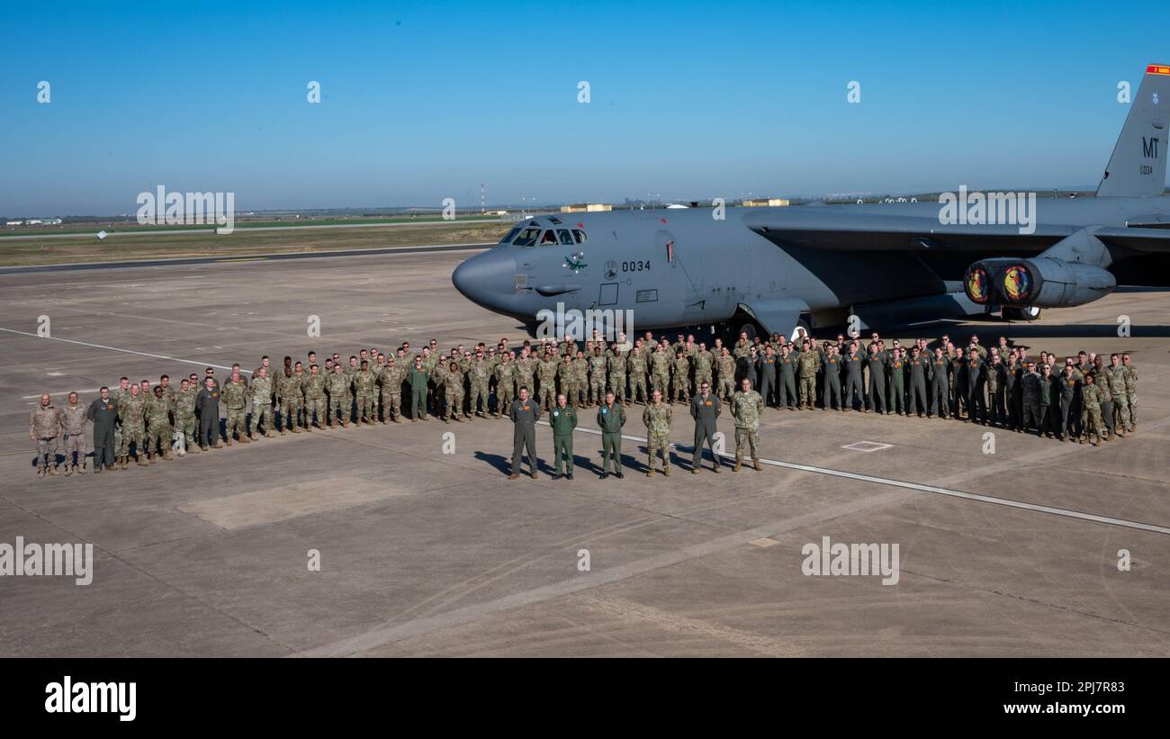 Members of the 23rd Expeditionary Bomb Squadron provide members of the ...