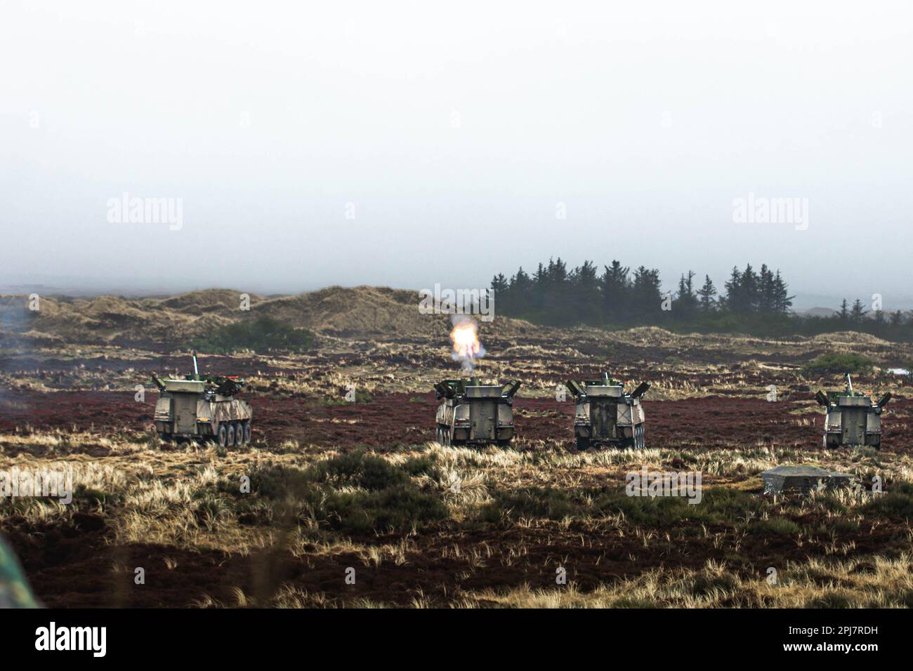 Danish soldiers with the 1st Artillery Battalion fire a Cardom 10, a ...