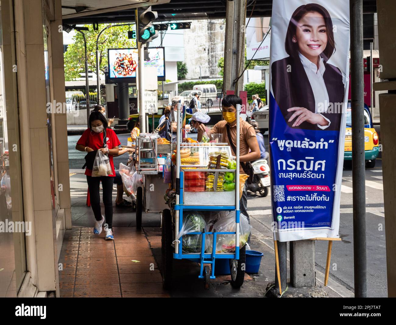 In the midst of a global pandemic, a street vendor and customer ...