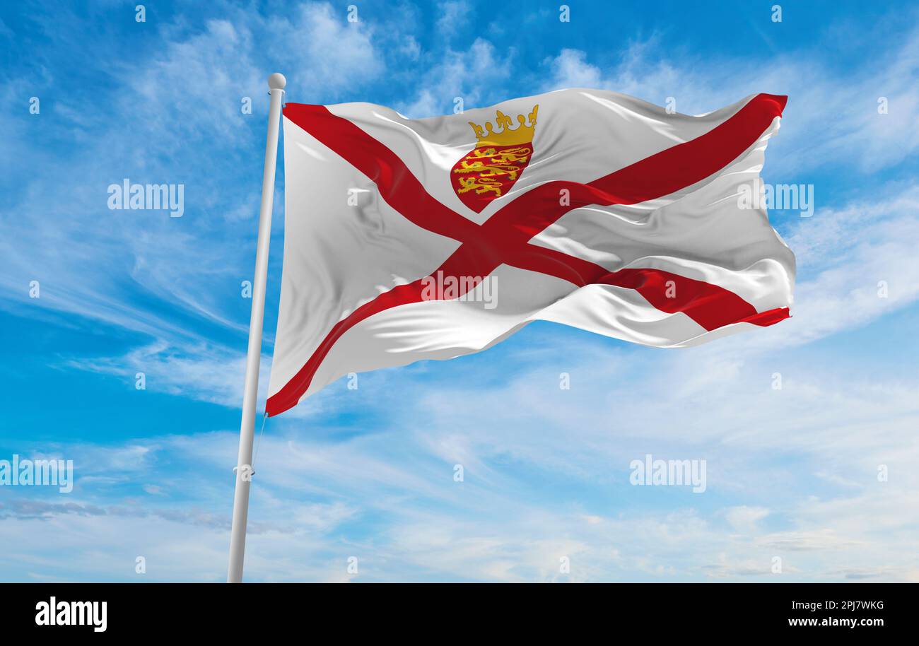 flag of Gallo-Romance peoples Jerriais people at cloudy sky background ...