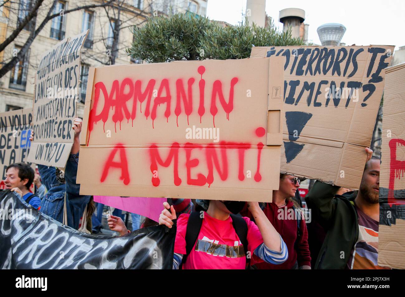 Marseille, France. 30th Mar, 2023. Protesters hold placards and a ...