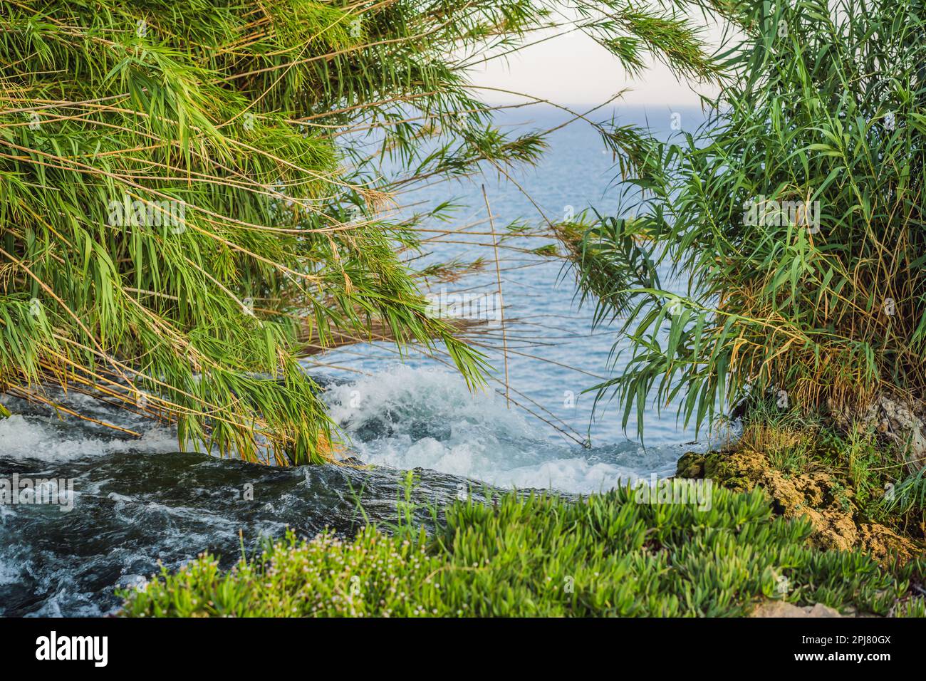 Lower Duden Falls drop off a rocky cliff falling from about 40 m into ...