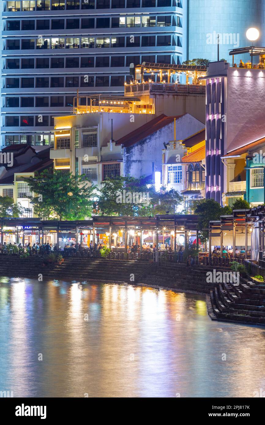 A night view of the Boat Quay on the Singapore River in Singapore. The ...