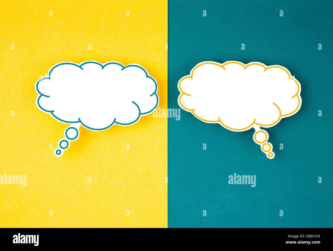 White speech bubble shaped post it note on green and yellow background ...