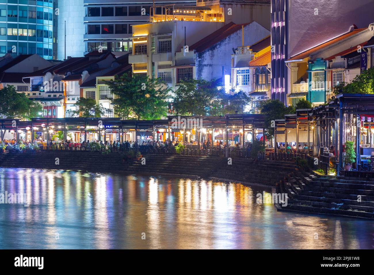 A night view of the Boat Quay on the Singapore River in Singapore. The ...