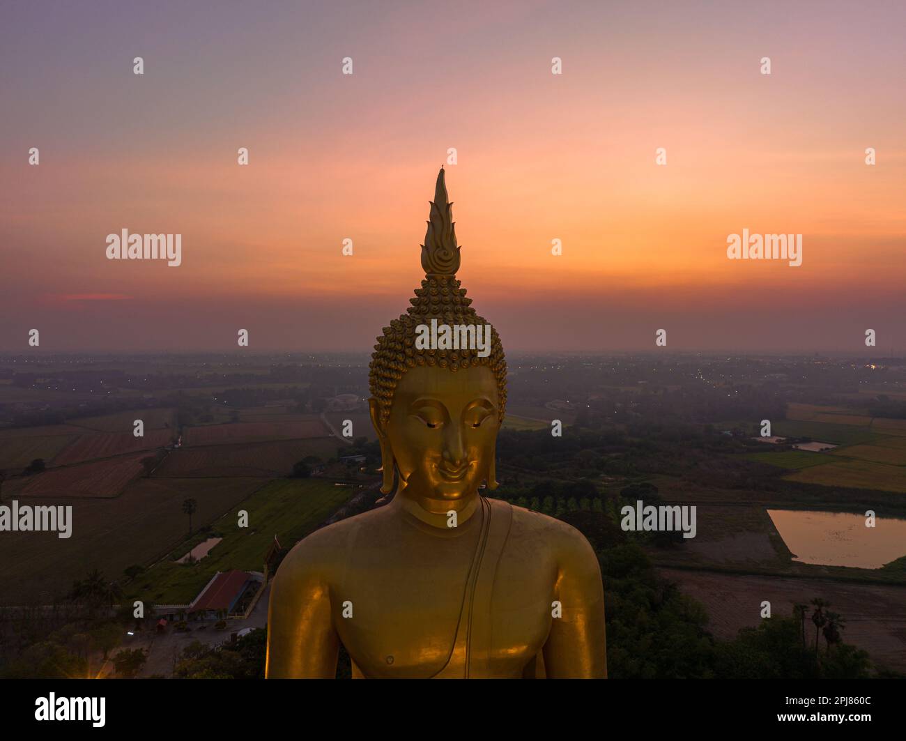 scenery sunset behind the great golden Buddha landmark of Thailand at ...