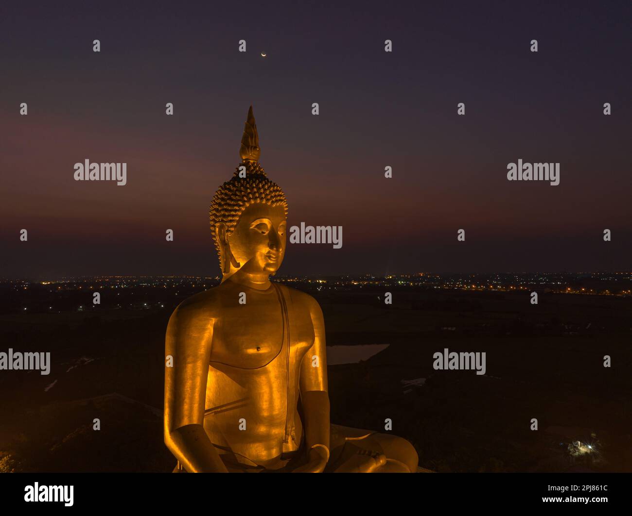 aerial view The moon was above the head of the biggest golden Buddha in ...