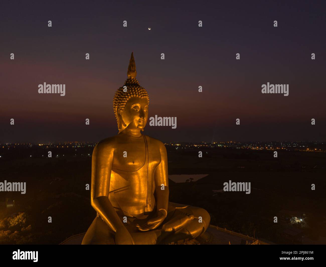 aerial view The moon was above the head of the biggest golden Buddha in ...