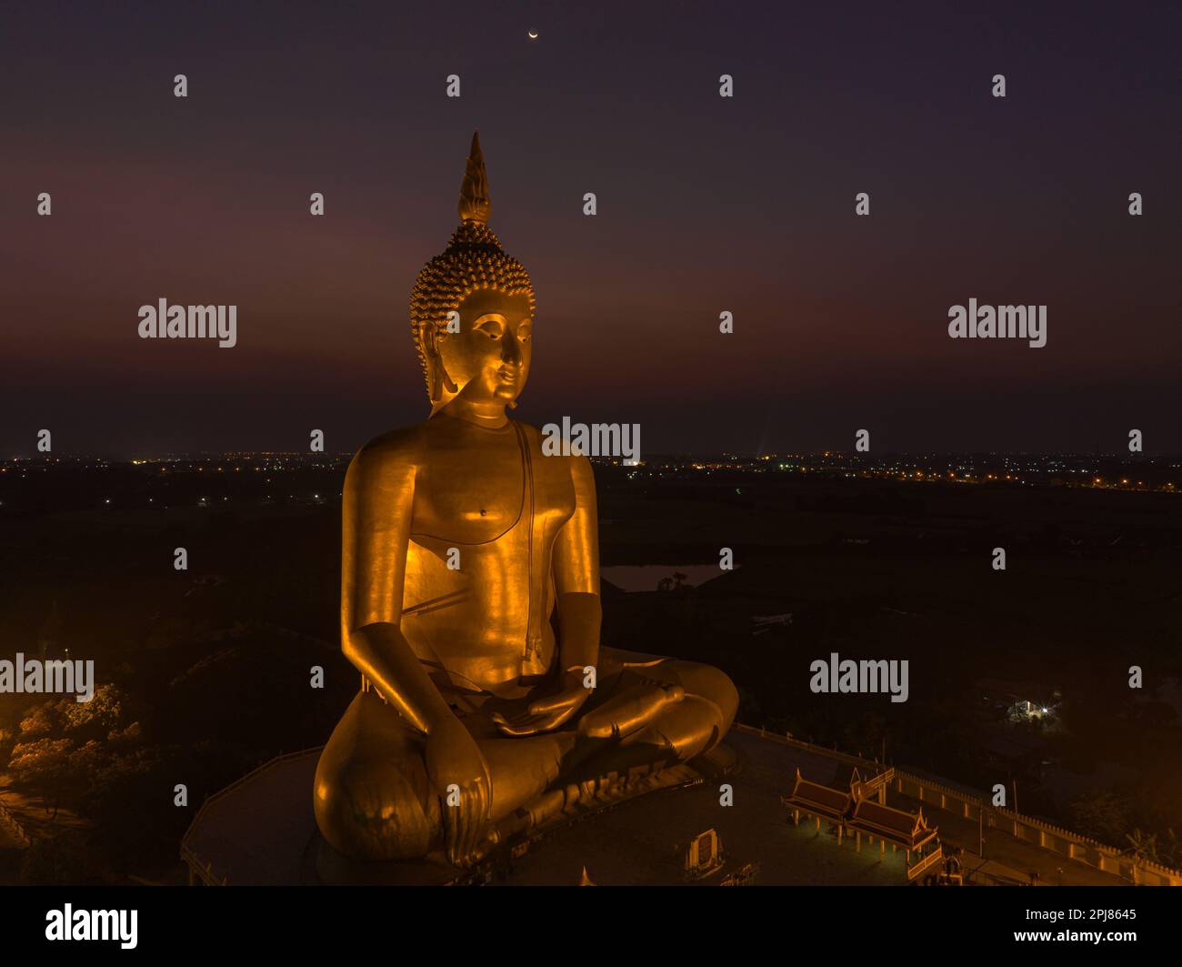 aerial view The moon was above the head of the biggest golden Buddha in ...