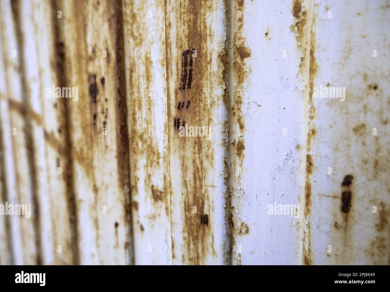 Detail of abandonment and ruin in an old metal protection wall Stock ...