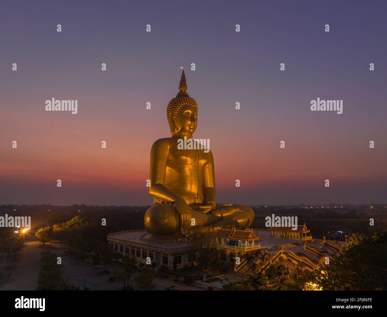 aerial view The moon was above the head of the biggest golden Buddha in ...