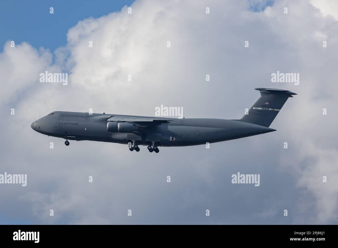 A close-up picture of a Boeing C-17 Globemaster III in the blue sky ...