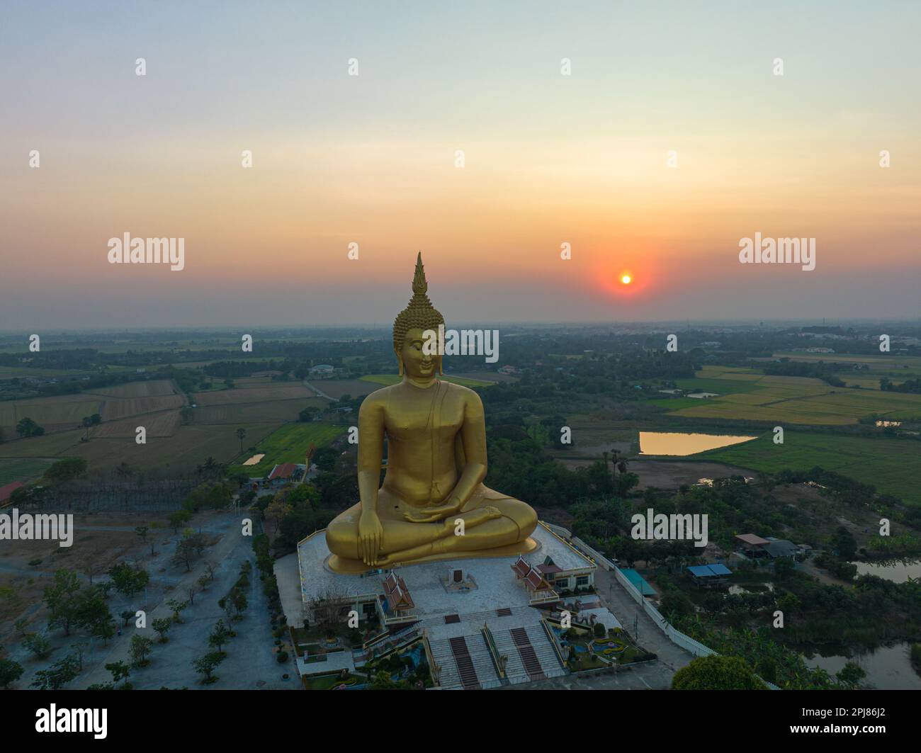 scenery sunset behind the great golden Buddha landmark of Thailand at ...